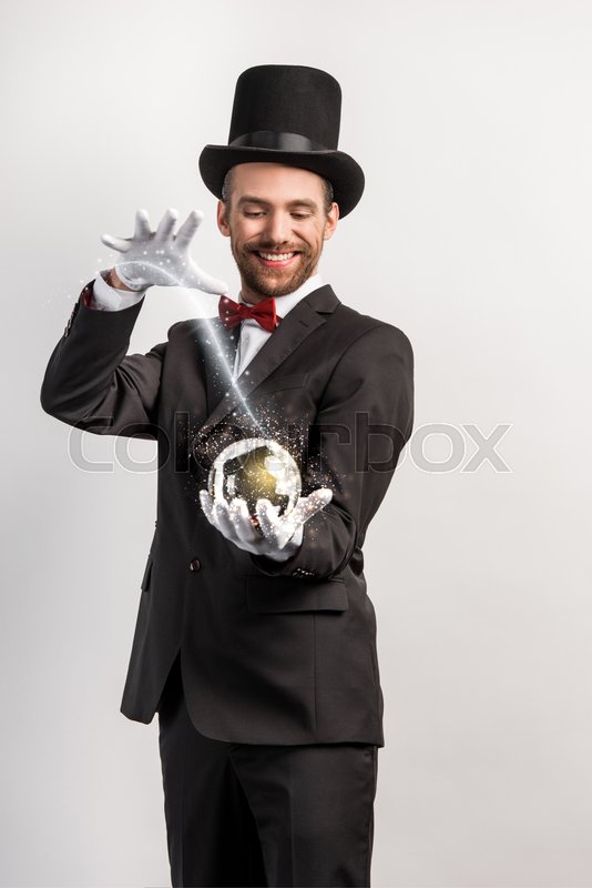 Happy professional magician holding ... | Stock image | Colourbox