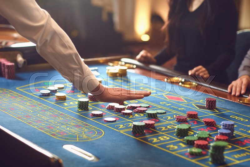 People gambling at roulette poker in a ... | Stock image | Colourbox