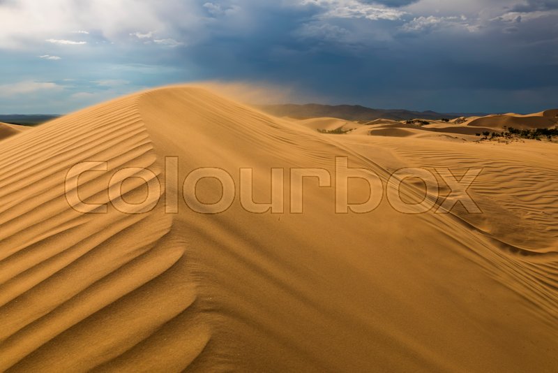 Storm clouds over sand dunes in the ... | Stock image | Colourbox