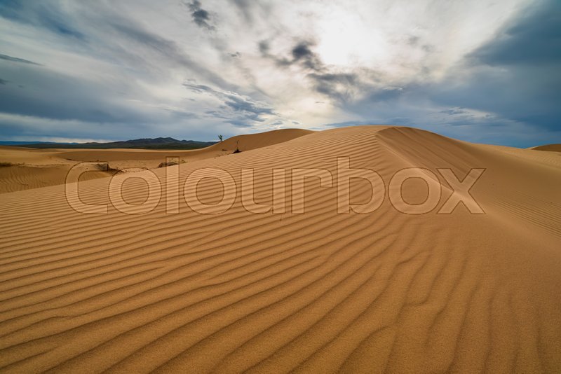 Storm clouds over sand dunes in the ... | Stock image | Colourbox