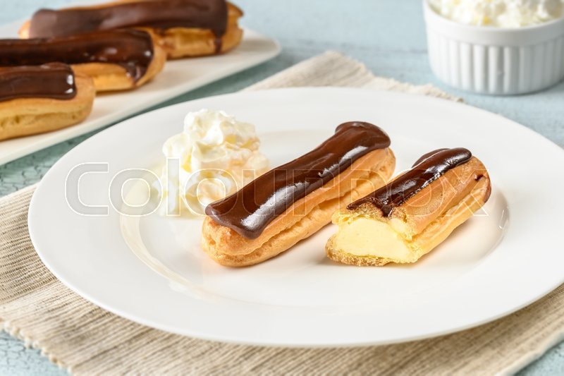 Eclairs with chocolate topping on ... | Stock image | Colourbox