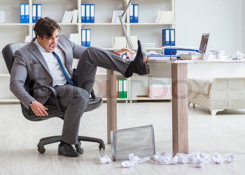 The angry businessman shocked working ... | Stock image | Colourbox