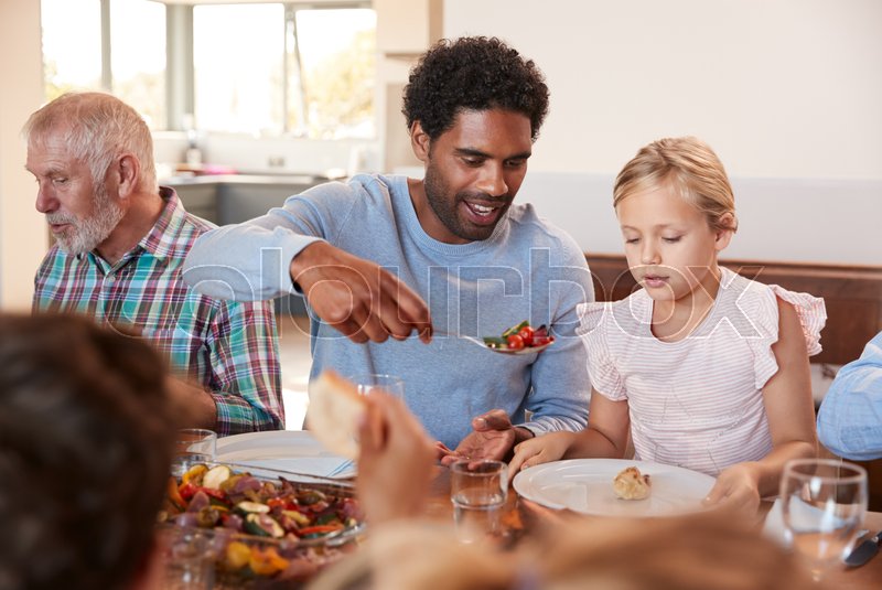 Father Serving Food As Multi-Generation ... | Stock image | Colourbox