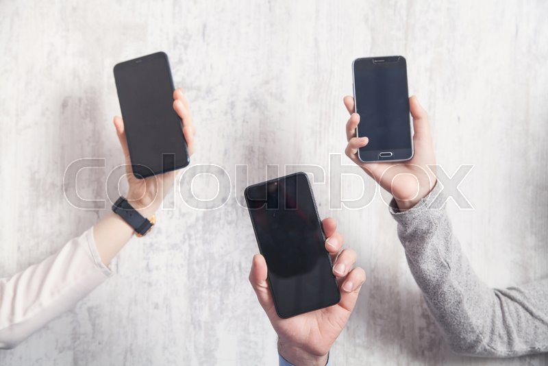People holding smartphones. Technology. ... | Stock image | Colourbox