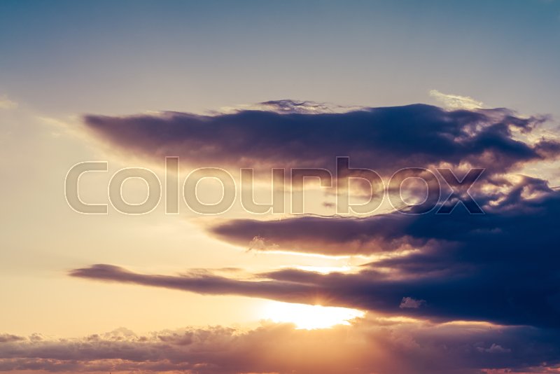 Sunrise, the sun is shining strong from ... | Stock image | Colourbox