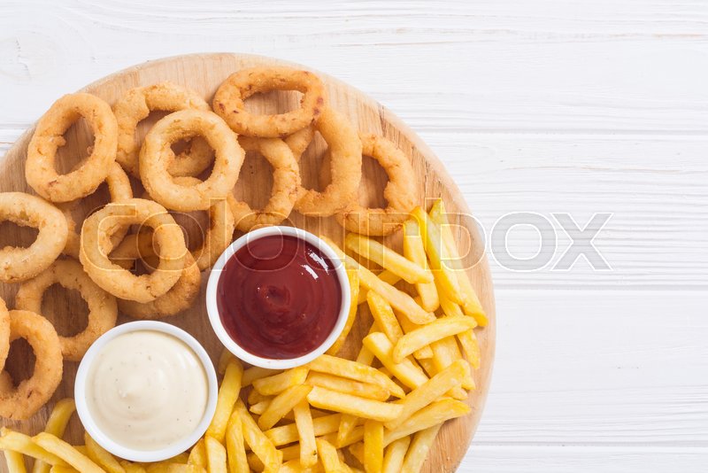 French fries and onion rings with ... | Stock image | Colourbox