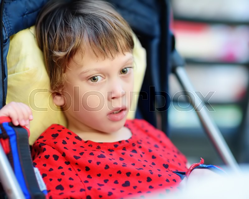 Portrait of a cute little disabled girl ... | Stock image | Colourbox