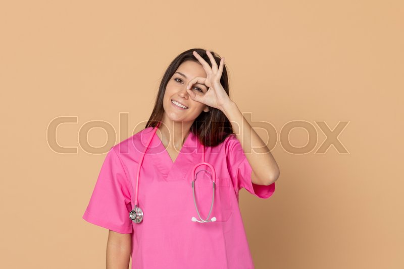 Young doctor wearing pink uniform on a ... | Stock image | Colourbox