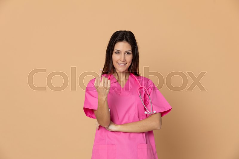 Young doctor wearing pink uniform on a ... | Stock image | Colourbox