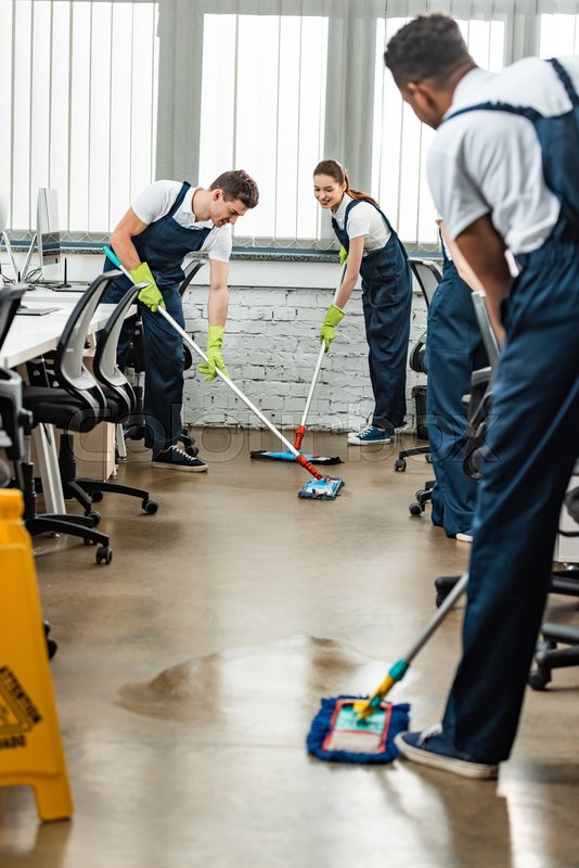 Multicultural team of young cleaners ... | Stock image | Colourbox