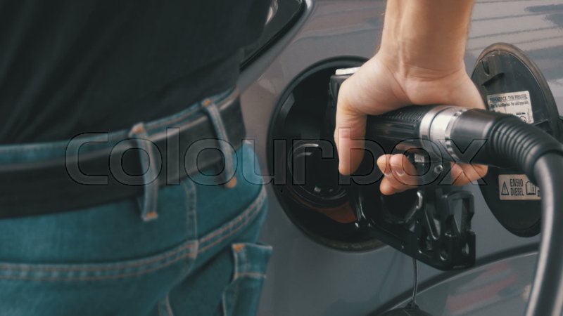 Man filling car with Diesel Fuel. Man's ... | Stock video | Colourbox