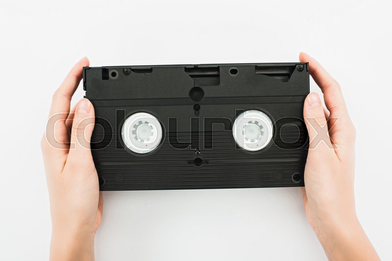 Partial view of man holding black VHS ... | Stock image | Colourbox