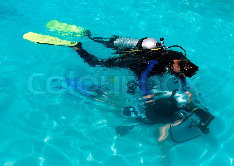 A boy taking scuba diving lessons in ... | Stock image | Colourbox