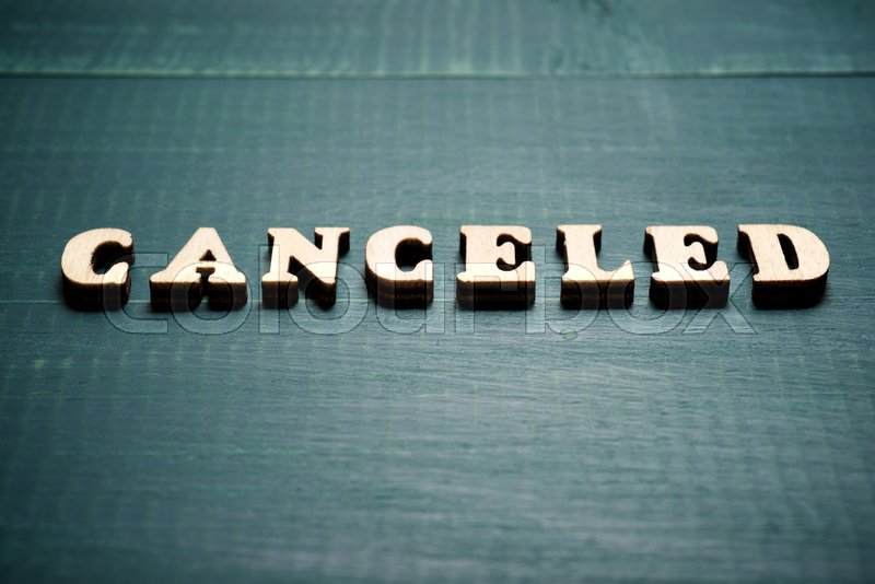 Canceled word on a wood table. | Stock image | Colourbox