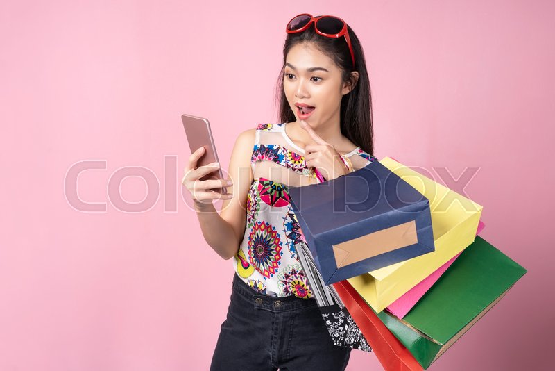 Portrait of young woman online shopping ... | Stock image | Colourbox