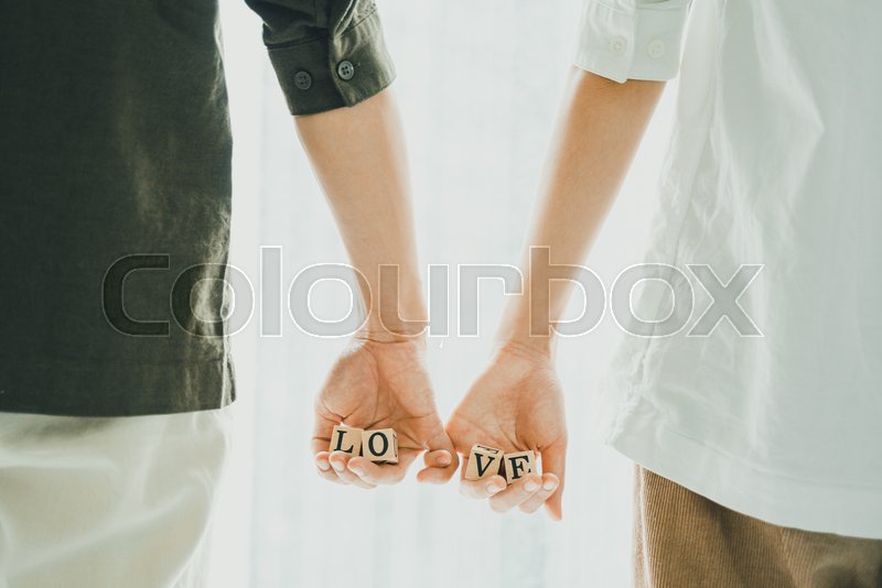 Closeup of couple hand holding the LOVE ... | Stock image | Colourbox