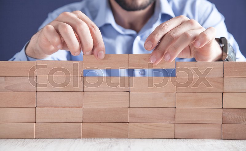 Man Stacking Wooden Blocks Development Stock Image Colourbox