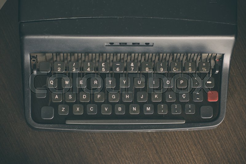 Vintage Black Typewriter over a wooden ... | Stock image | Colourbox