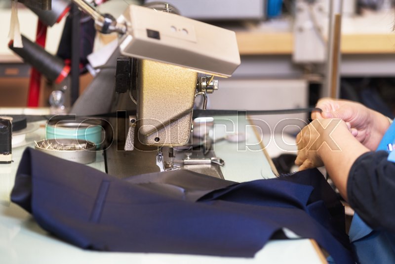 Woman tailor working on sewing machine. ... | Stock image | Colourbox