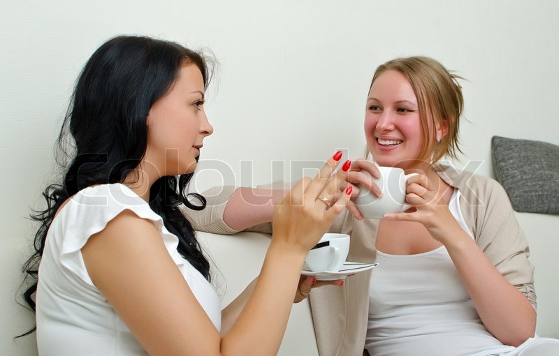 Two women friends chatting over coffee ... | Stock image | Colourbox