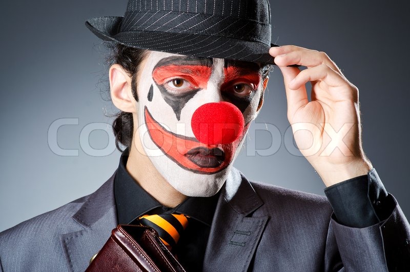 Businessman with clown wig and face ... | Stock image | Colourbox