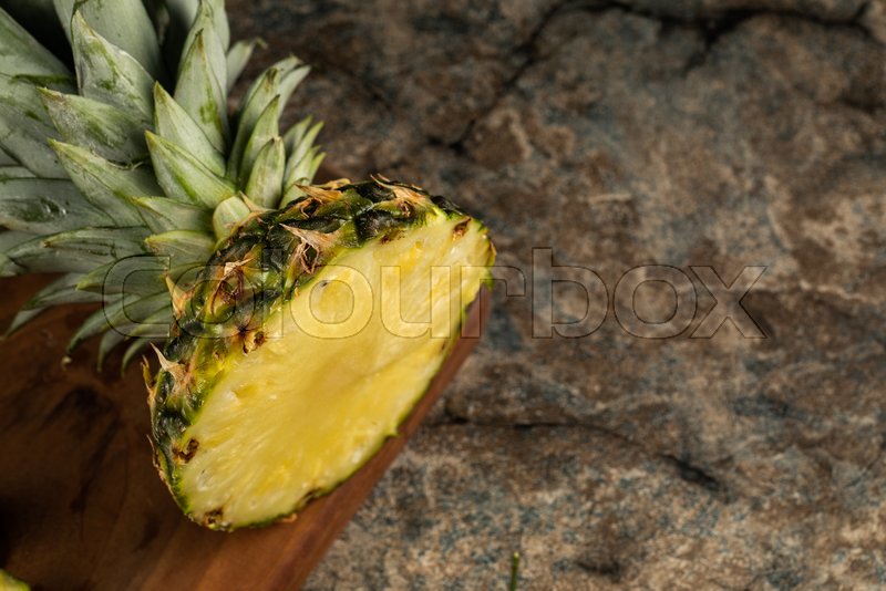 Half cut pineapple isolated on black ... | Stock image | Colourbox