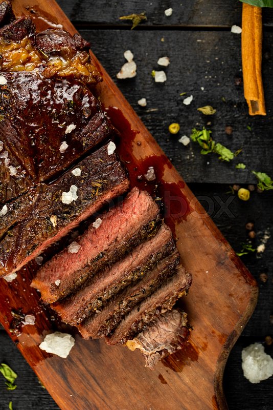 Raw cooked meat steak sliced and salt ... | Stock image | Colourbox