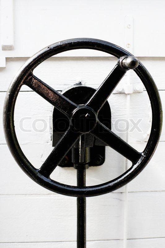 Old locomotive steering wheel made of ... | Stock image | Colourbox
