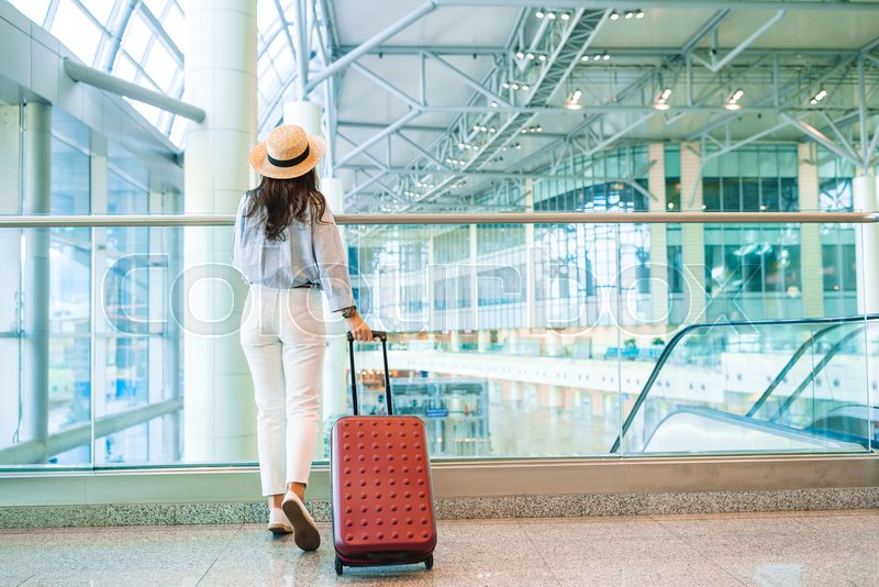Young woman with baggage in ... | Stock image | Colourbox