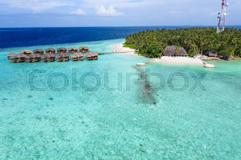 Small island in the Maldives covered by ... | Stock image | Colourbox