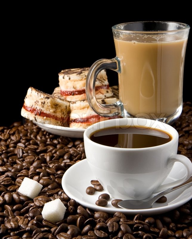 Cup of coffee beans and sweets | Stock image | Colourbox