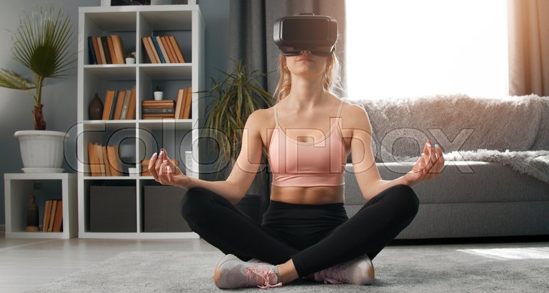 Front view of young woman using VR ... | Stock image | Colourbox