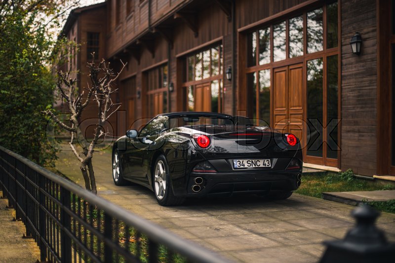 Black modern car in the yard in front ... | Stock image | Colourbox