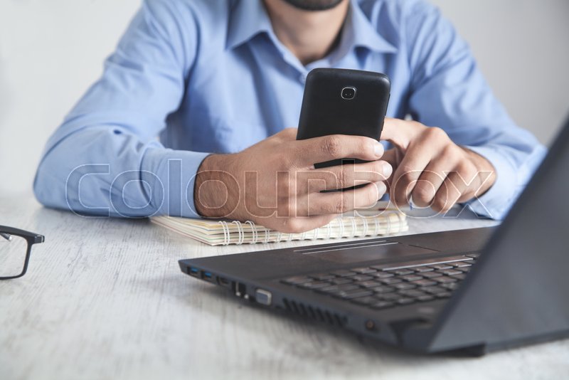 Human using smartphone. Working in ... | Stock image | Colourbox