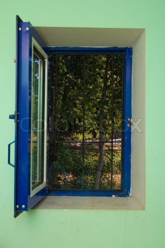 Blue window on the house as a ... | Stock image | Colourbox