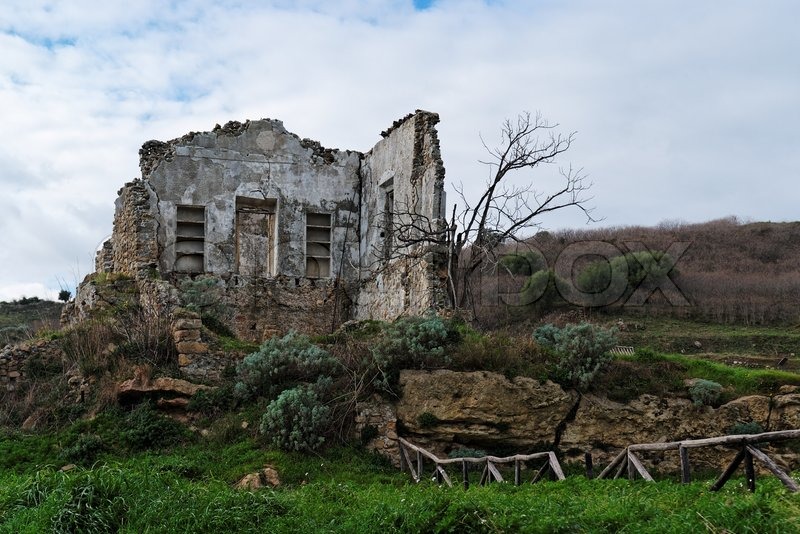 Farmhouse ruin among rural landscape | Stock image | Colourbox