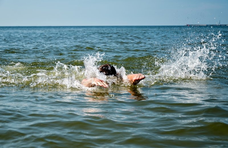 Young male swimming in the sea/ocean | Stock image | Colourbox
