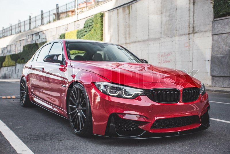 Red universal suv in front of a sales ... | Stock image | Colourbox