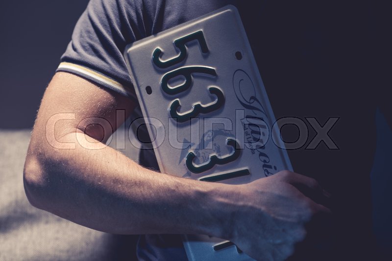 Caucasian Male Holding License Plate ... | Stock image | Colourbox