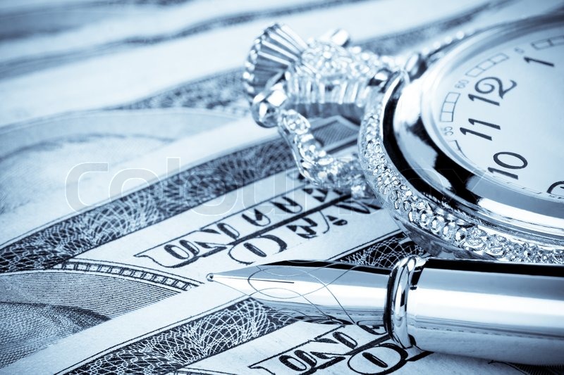 Ink pen and watch on dollar banknotes | Stock image | Colourbox