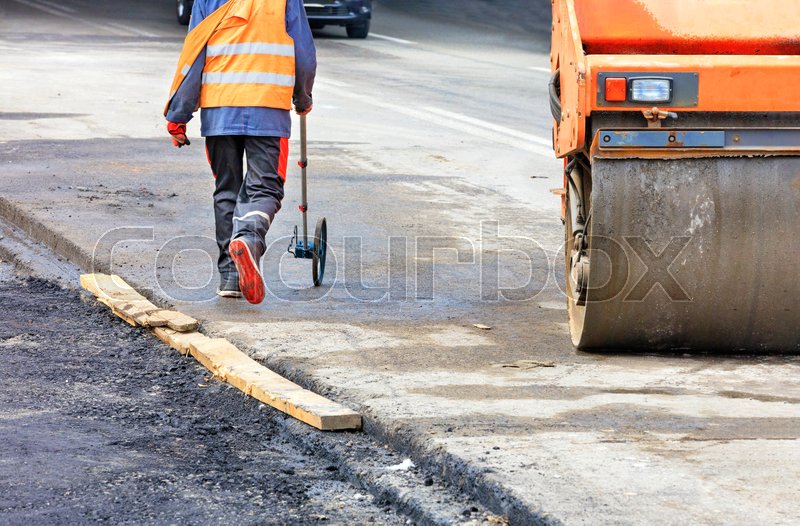 A road engineer working on the road ... | Stock image | Colourbox