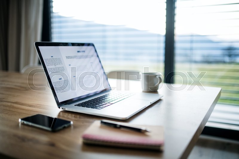 Laptop on table in home office | Stock image | Colourbox