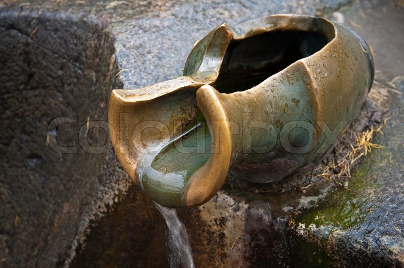 Broken jug with spring | Stock image | Colourbox