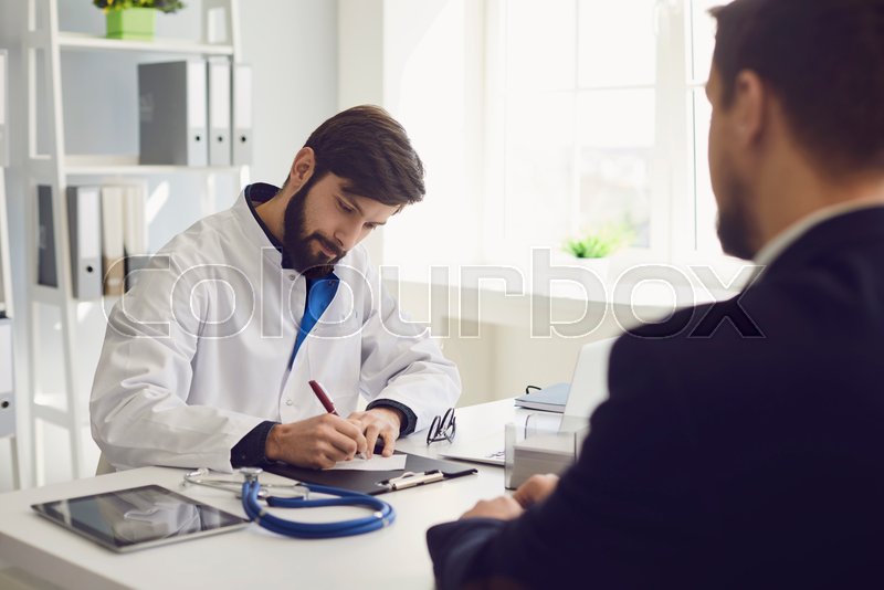 Patient visiting doctor at clinic ... | Stock image | Colourbox