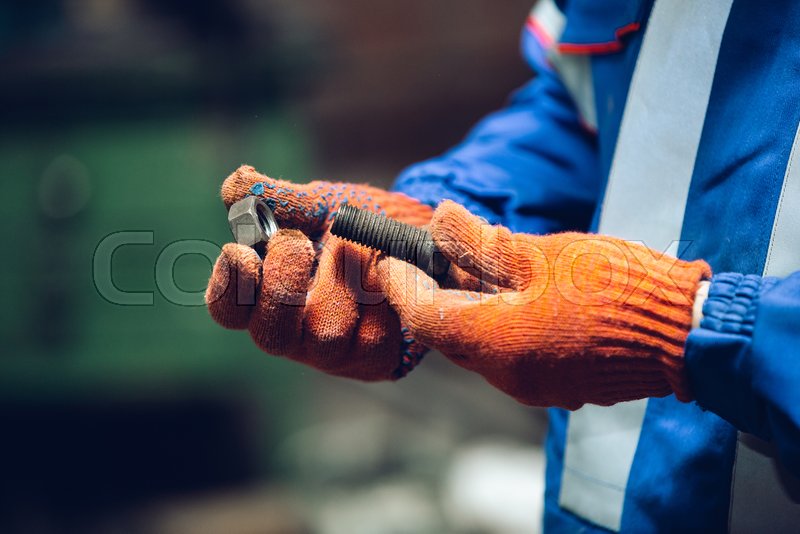 Closeup of repairman in uniform, ... | Stock image | Colourbox