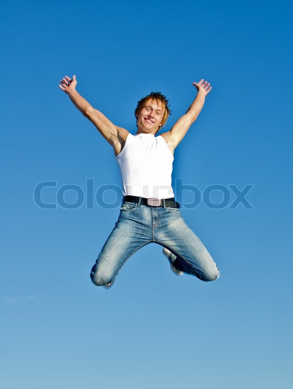 Happy jumping man on blue sky ... | Stock image | Colourbox