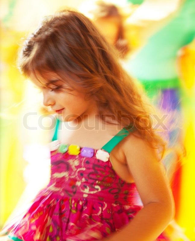 Beautiful little girl dancing over ... | Stock image | Colourbox