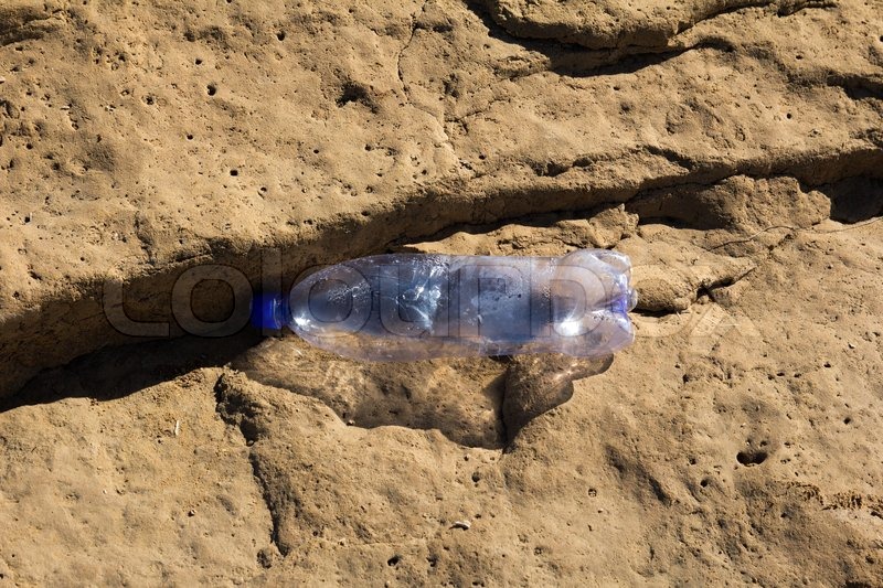 Plastic bottle on the ground | Stock image | Colourbox