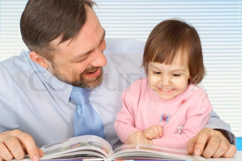 Caring father entertains his baby | Stock image | Colourbox
