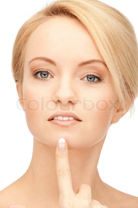 Beautiful woman pointing to chin | Stock image | Colourbox